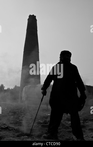 silhouette of a kiln worker Stock Photo - Alamy