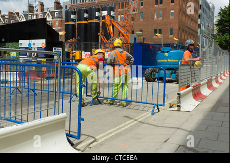 British Construction workers, standing about, Davies Street, London W1 ...