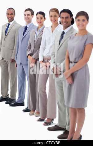 business people standing and looking straight ahead in a modern office ...