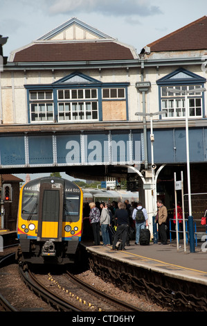 Passengers boarding a class 444 train in South West Trains livery at ...