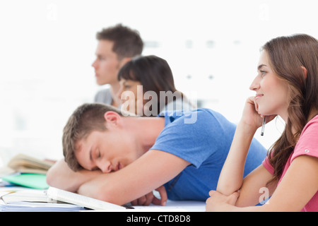 Student taking a nap in class Stock Photo - Alamy