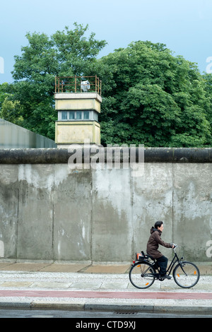 Section of the original Berlin Wall with a watchtower, in Berlin ...