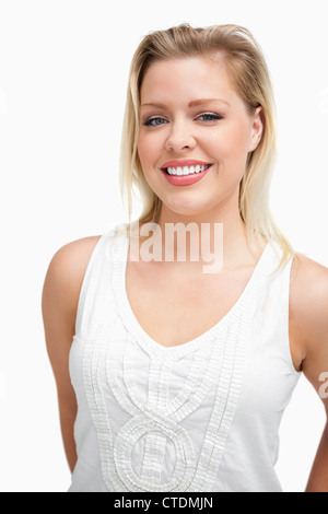Smiling blonde woman standing upright Stock Photo - Alamy