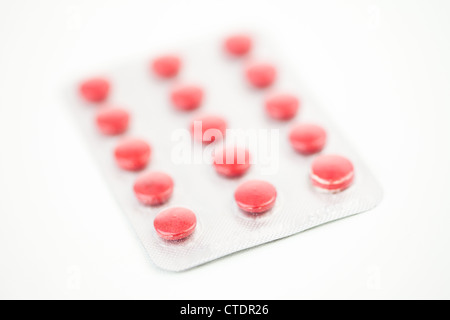 Red capsule medications Stock Photo - Alamy