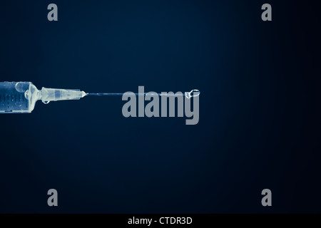 Drop outgoing of a syringe Stock Photo - Alamy