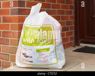 clothes for charity collection bag Age UK Stock Photo - Alamy