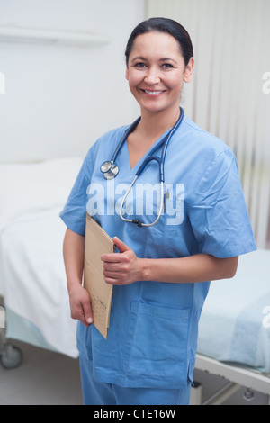Nurse holding a chart Stock Photo - Alamy