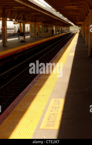 Yellow warning lines on a subway or train station platform. Safety ...