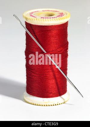 Vertical shot of a red sewing thread Stock Photo - Alamy
