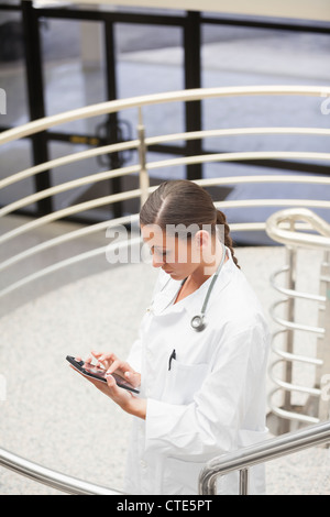 High angle view of tablet computer with ingredients on kitchen counter ...