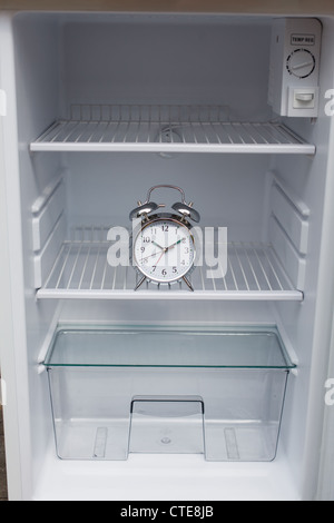 Clock in a fridge Stock Photo - Alamy