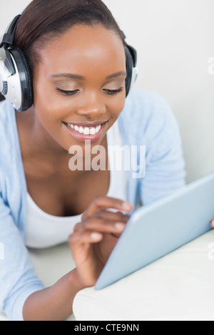 Woman touching a computer in her room Stock Photo - Alamy