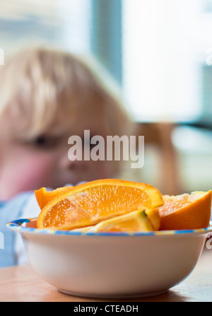 cheerful child eat citrus orange fruit full of vitamins isolated on ...