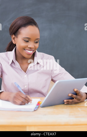 Teacher holding an ebook Stock Photo - Alamy