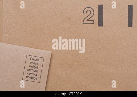 Postage required and postage paid brown return envelopes Stock Photo ...