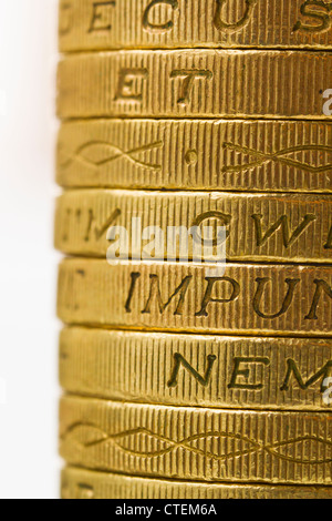pound GBP coin and gold money on the desk Stock Photo - Alamy