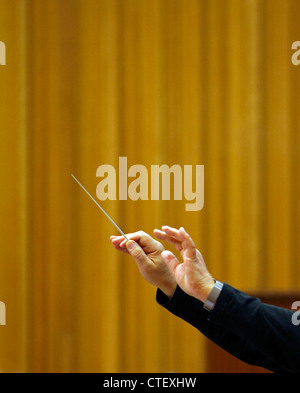 generic image of a conductors hands in a rehearsal Stock Photo - Alamy