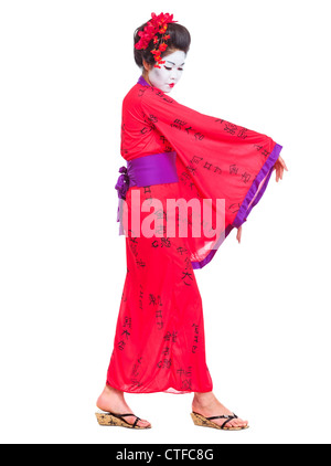 Full length portrait of geisha dancing with fans isolated on white ...