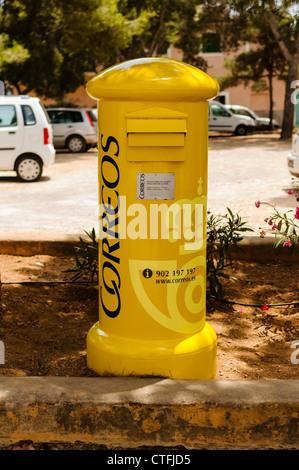 Yellow Spanish post box of the national postal service, Correos, in ...