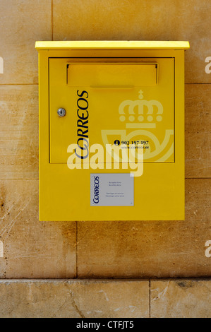 A collection of metal letterboxes or post boxes outside an apartment ...