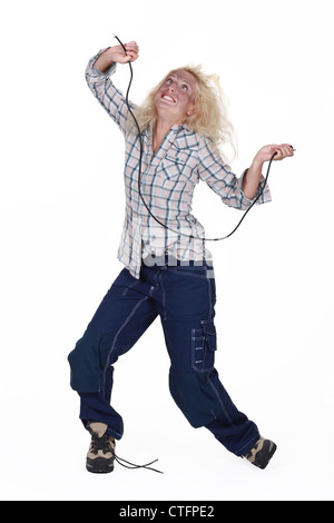 A woman being electrocuted Stock Photo - Alamy