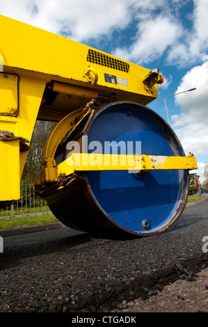 road roller rolling tarmac on a new road Stock Photo - Alamy