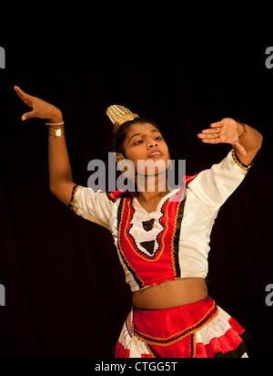 Woman dancing traditional Kandyan dance at a tourist show in Kandy, Sri ...