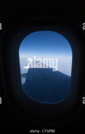 Looking through a window of an Airbus A320 while flying over Aegean sea ...