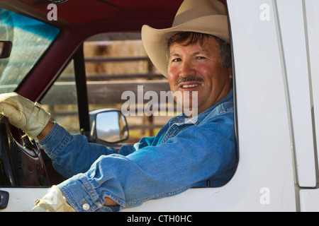 Hispanic man driving truck Stock Photo - Alamy