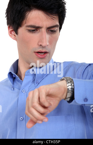 Businessman realizing he is late Stock Photo - Alamy