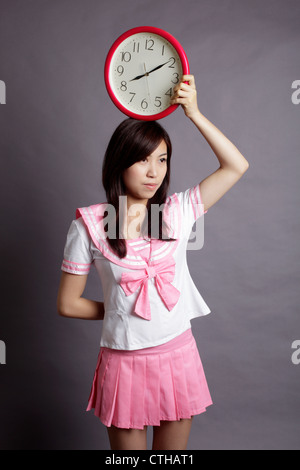 School girl plays clock Stock Photo - Alamy