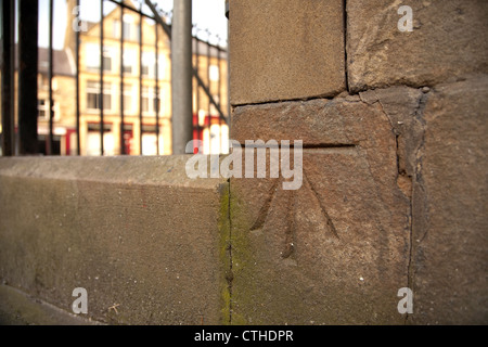 Ordnance Survey surveyors benchmark carved in stone on a wall in ...