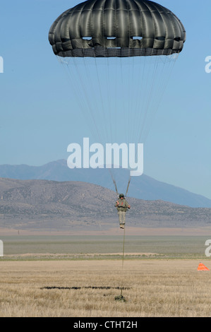 A Blackhawk helicopter prepares to land with Special Forces candidates ...