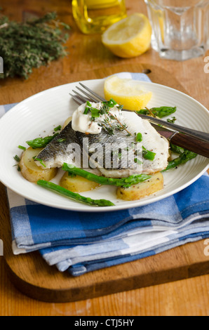 Grilled sea bass fish with spices served lemon Stock Photo - Alamy
