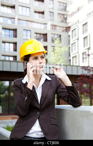 woman construction worker builder talking mobile phone Stock Photo - Alamy