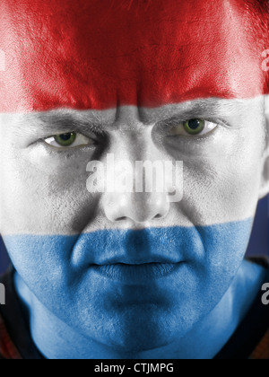 Young Male Sports Fan With Dutch Flag Painted On Face Stock Photo - Alamy