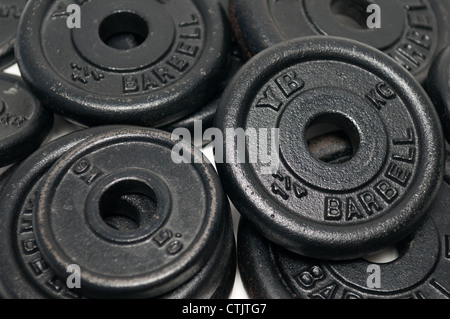 Pile of dumbbell weight discs Stock Photo - Alamy
