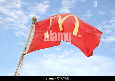 McDonald's logo flag flying in the breeze outside a McDonald's ...