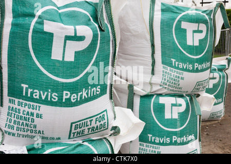 Builders bags full of building material sand and stone and a pack of ...
