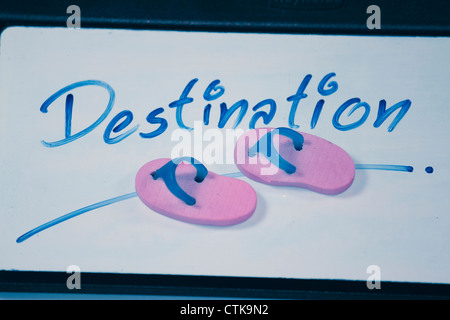 Miniature rubber slippers with wording Destination, Concept Stock Photo ...