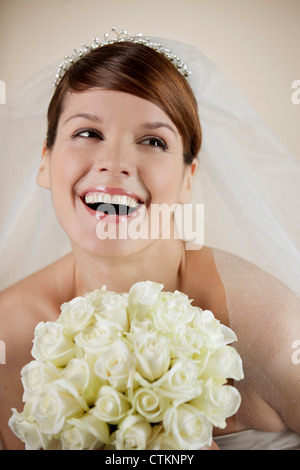 Young woman with bouquet of beautiful roses on purple background Stock ...