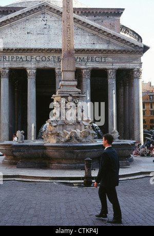 A Man dressed in roman attire describing roman tools to young child ...