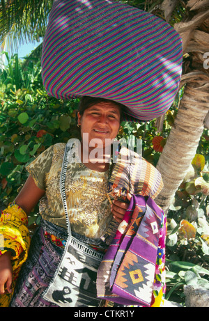Indigenous woman selling textiles on the market in Chichicastenango ...