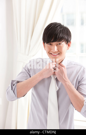 Young man preparing for going out Stock Photo - Alamy