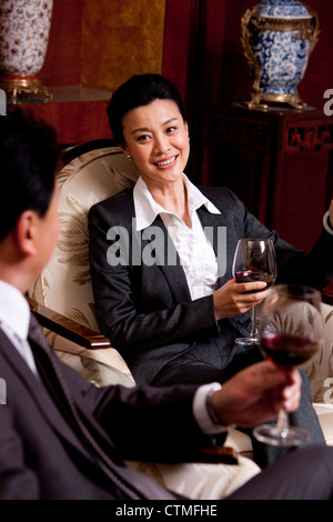 Businessmen talking in ornate room Stock Photo - Alamy