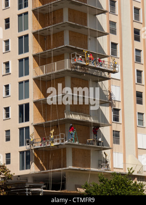 High rise building maintenance crew cleaning with pressure washer Stock ...