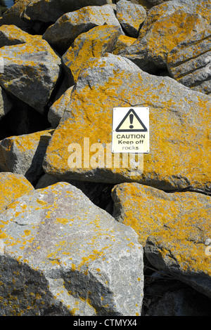 A keep off the rocks warning sign Stock Photo - Alamy