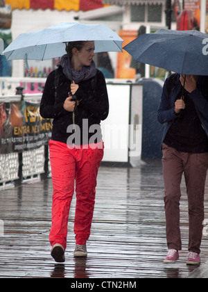 A wet summers day on the pier at Brighton Stock Photo - Alamy