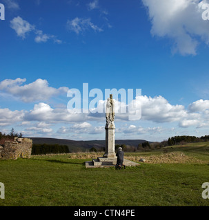 Pilgrim praying, at 'Our Lady of Penrhys' Statue, Penrhys, South Wales ...