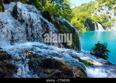 Small waterfall (closeup) and azure limpid lake in Plitvice Lakes ...